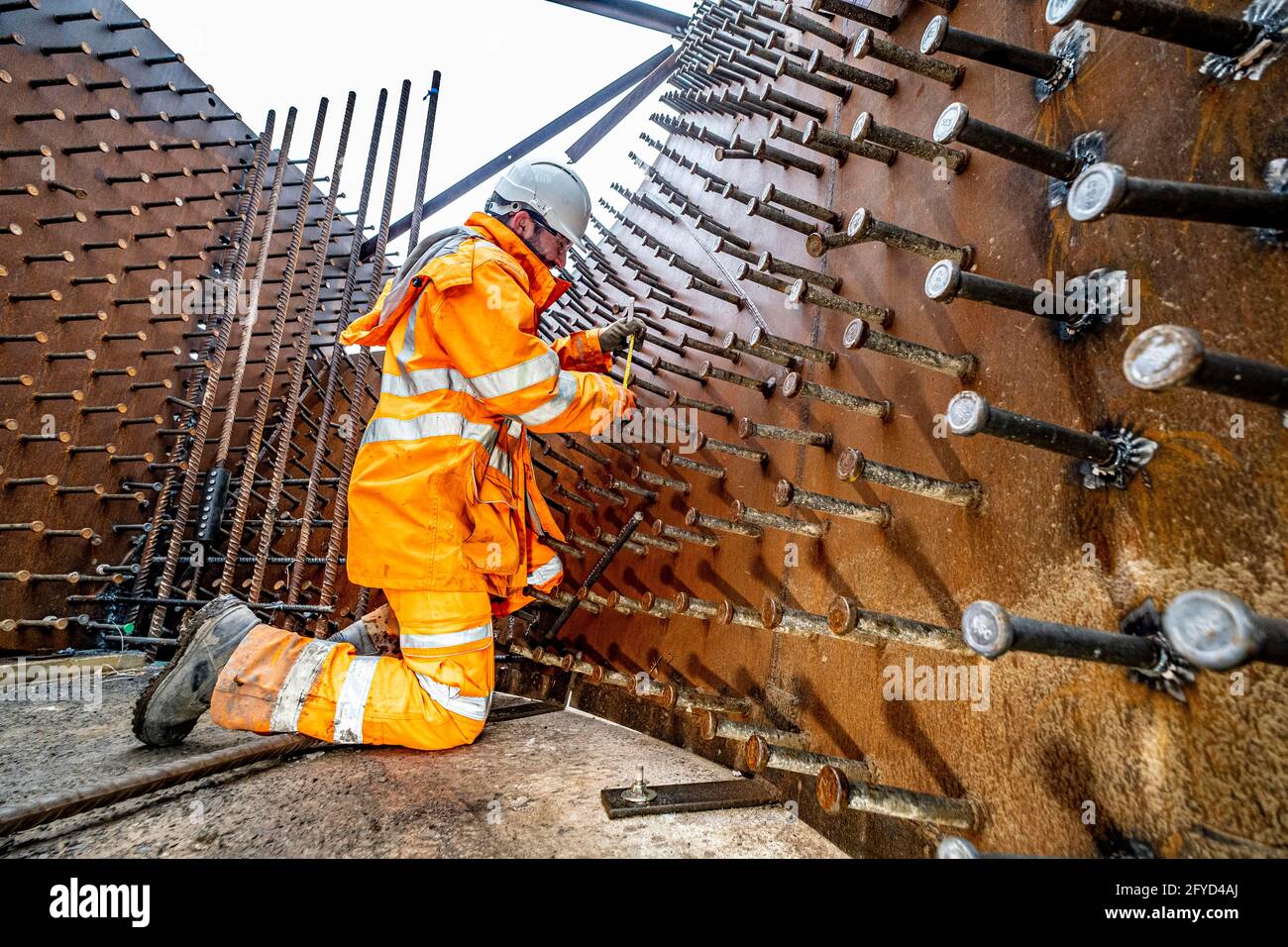 Construction workers in action on construction site Stock Photo - Alamy