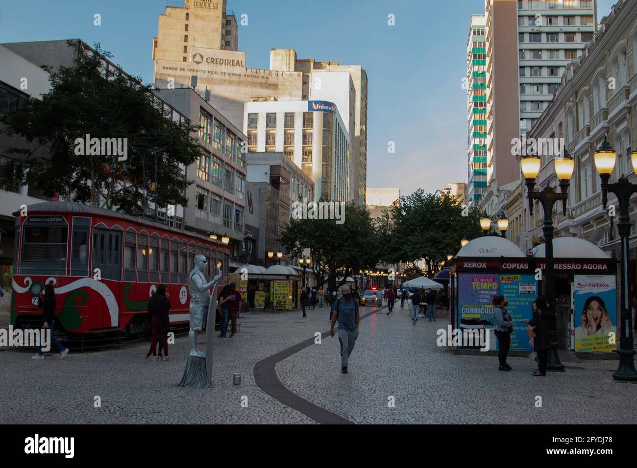 Curitiba, Brazil. 21st May, 2021. People walk through the street of ...