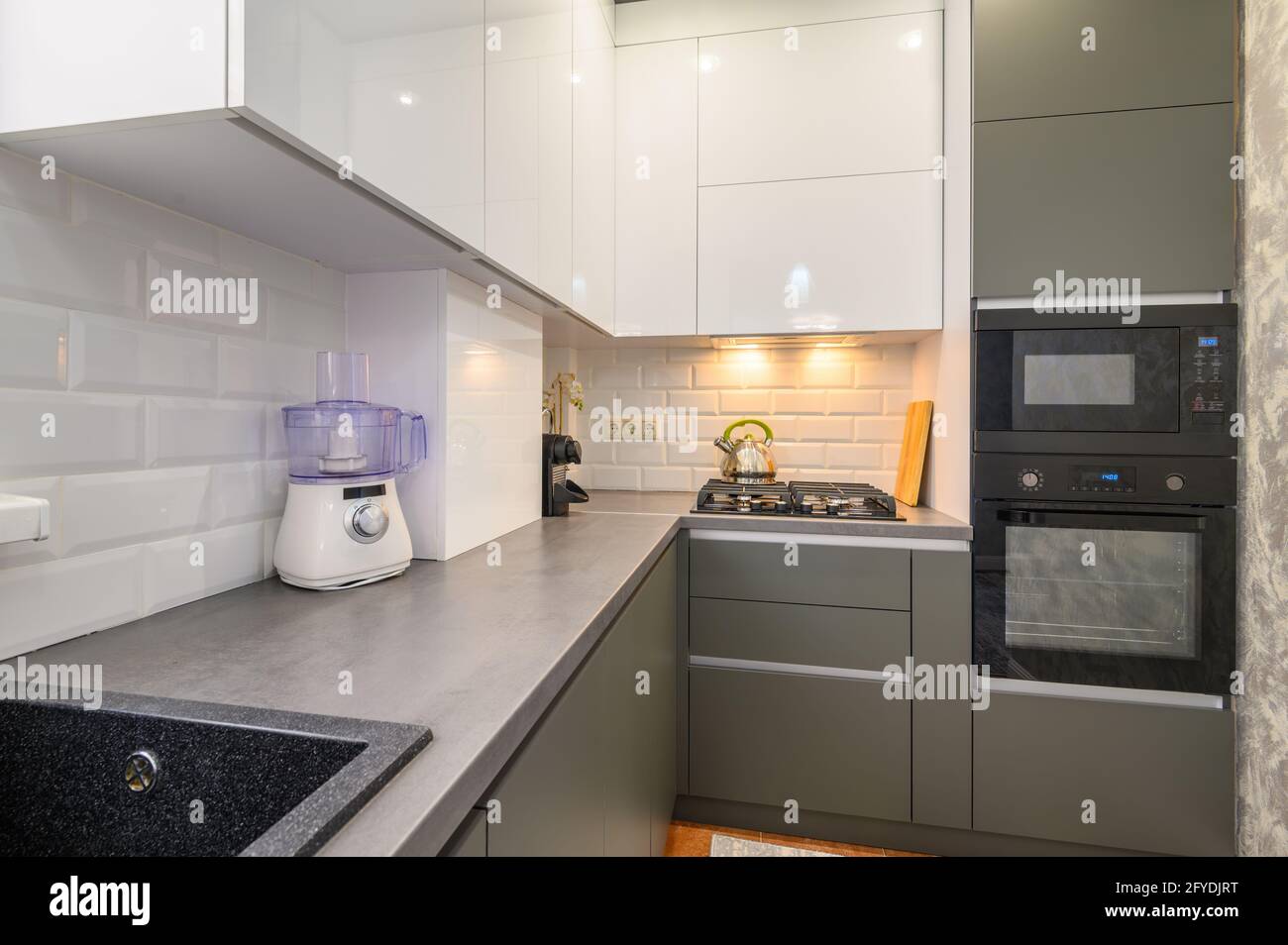 Modern dark grey small kitchen interior Stock Photo - Alamy