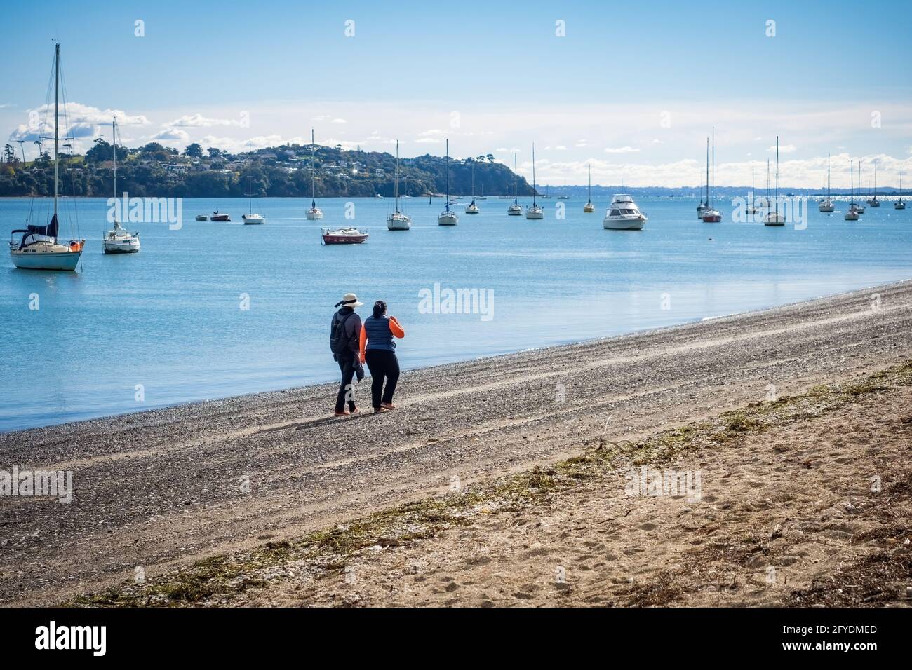 AUCKLAND, NEW ZEALAND - May 19, 2021: Two women walking along Bucklands ...