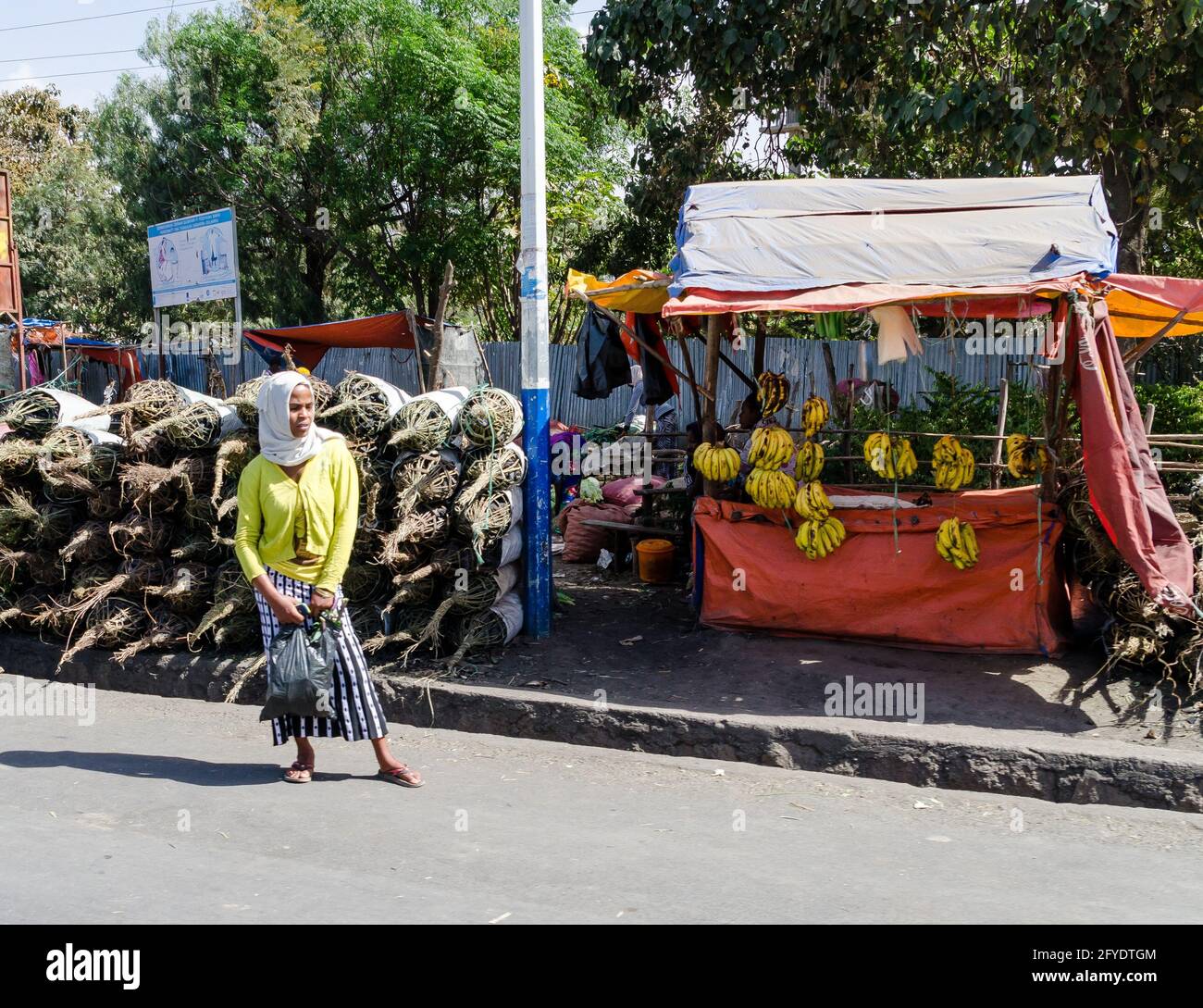 SHASHEMENE, ETHIOPIA - May 19, 2021: Woman waiting for transpiration on ...