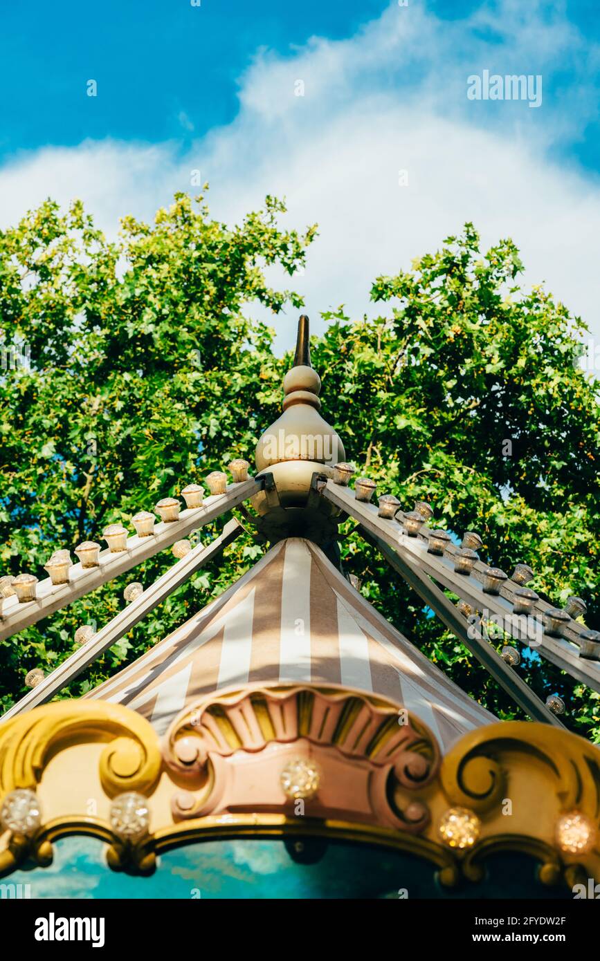 Vertical shot of a carousel in an amusement park Stock Photo - Alamy