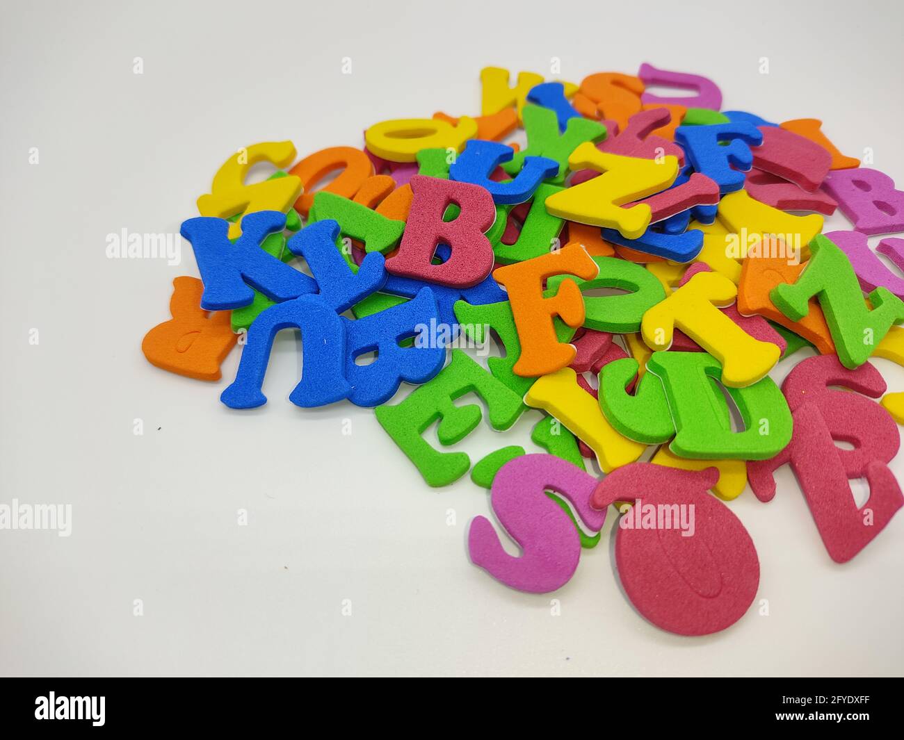 Pile of colorful letters isolated on a white background Stock Photo - Alamy