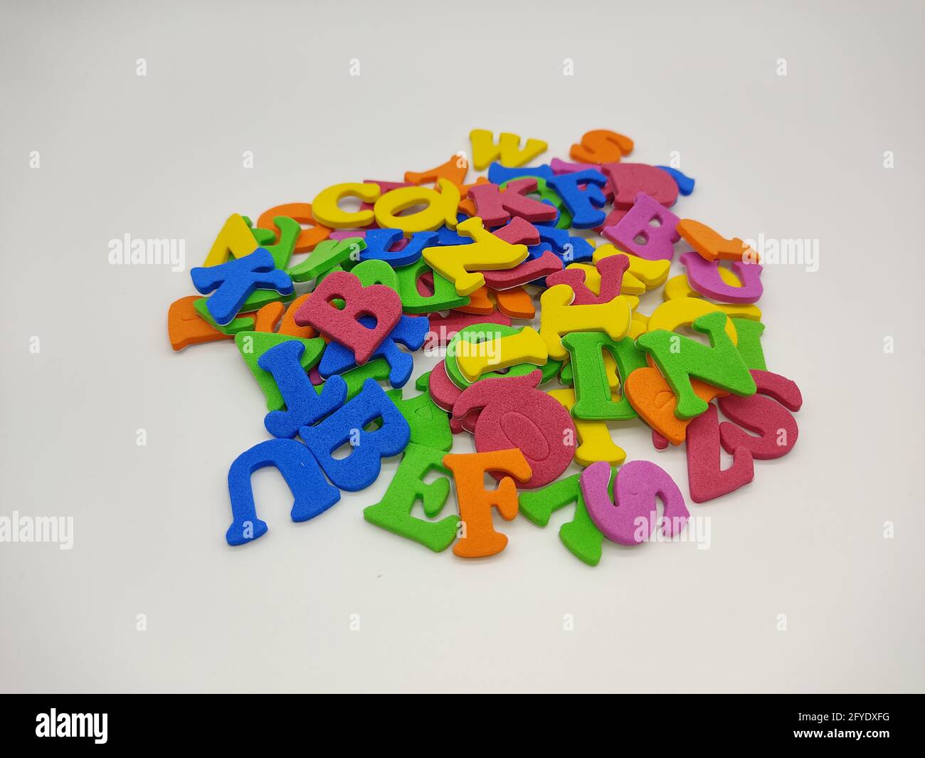Pile of colorful letters isolated on a white background Stock Photo - Alamy