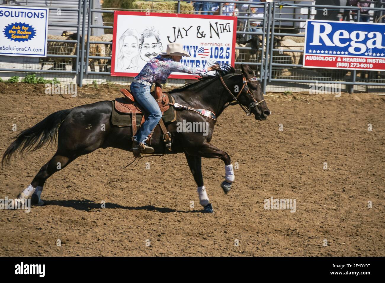 Santa Maria, CA, USA - June 6, 2010: Rodeo barrel racing. Cowgirl races ...