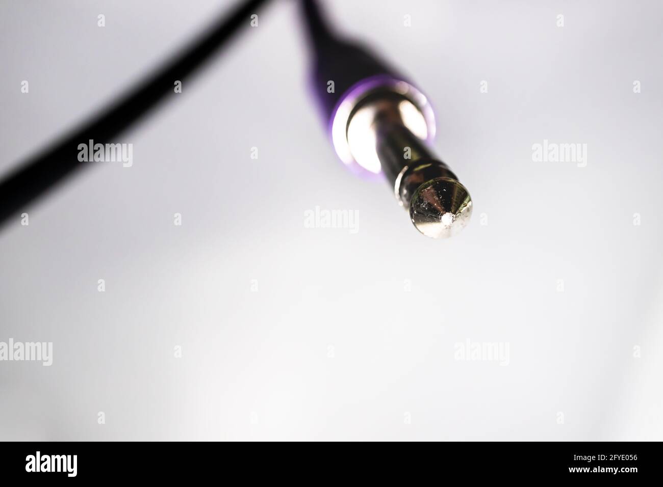 Macro Closeup of Tip on Quarter Inch Jack Dangling From Cable Against ...