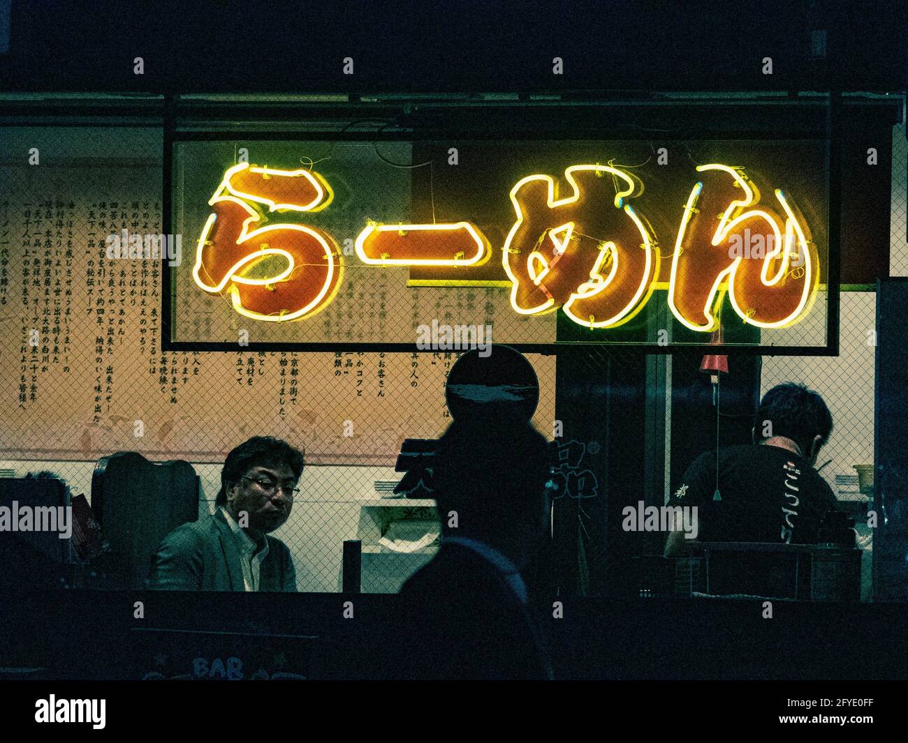 Neon sign and customers in a ramen restaurant, Kyoto, Japan Stock Photo ...