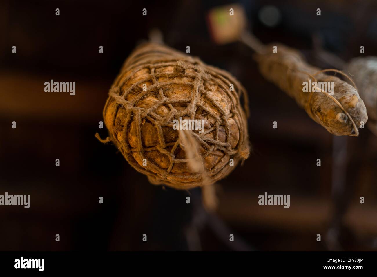 Low angle view of hanging dry-cured ham Stock Photo - Alamy