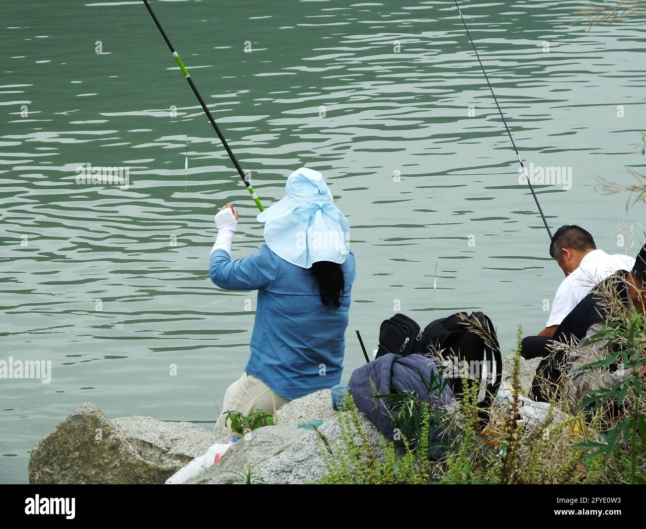 YICHANG, CHINA - MAY 27, 2021 - Fishing enthusiasts fish on the banks ...