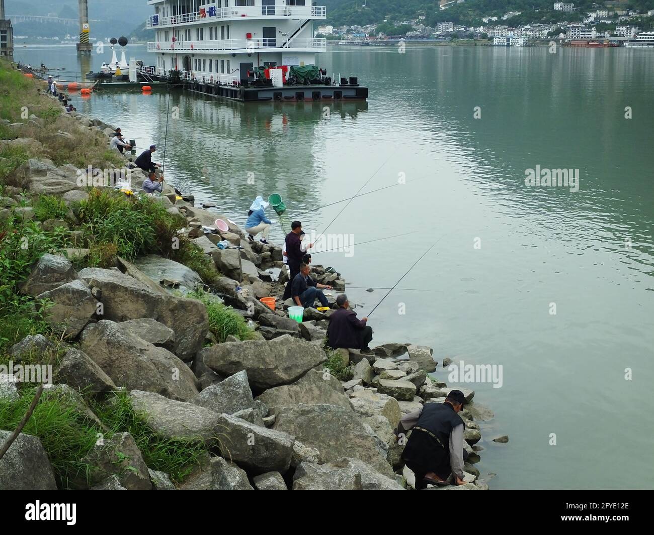 YICHANG, CHINA - MAY 27, 2021 - Fishing enthusiasts fish on the banks ...
