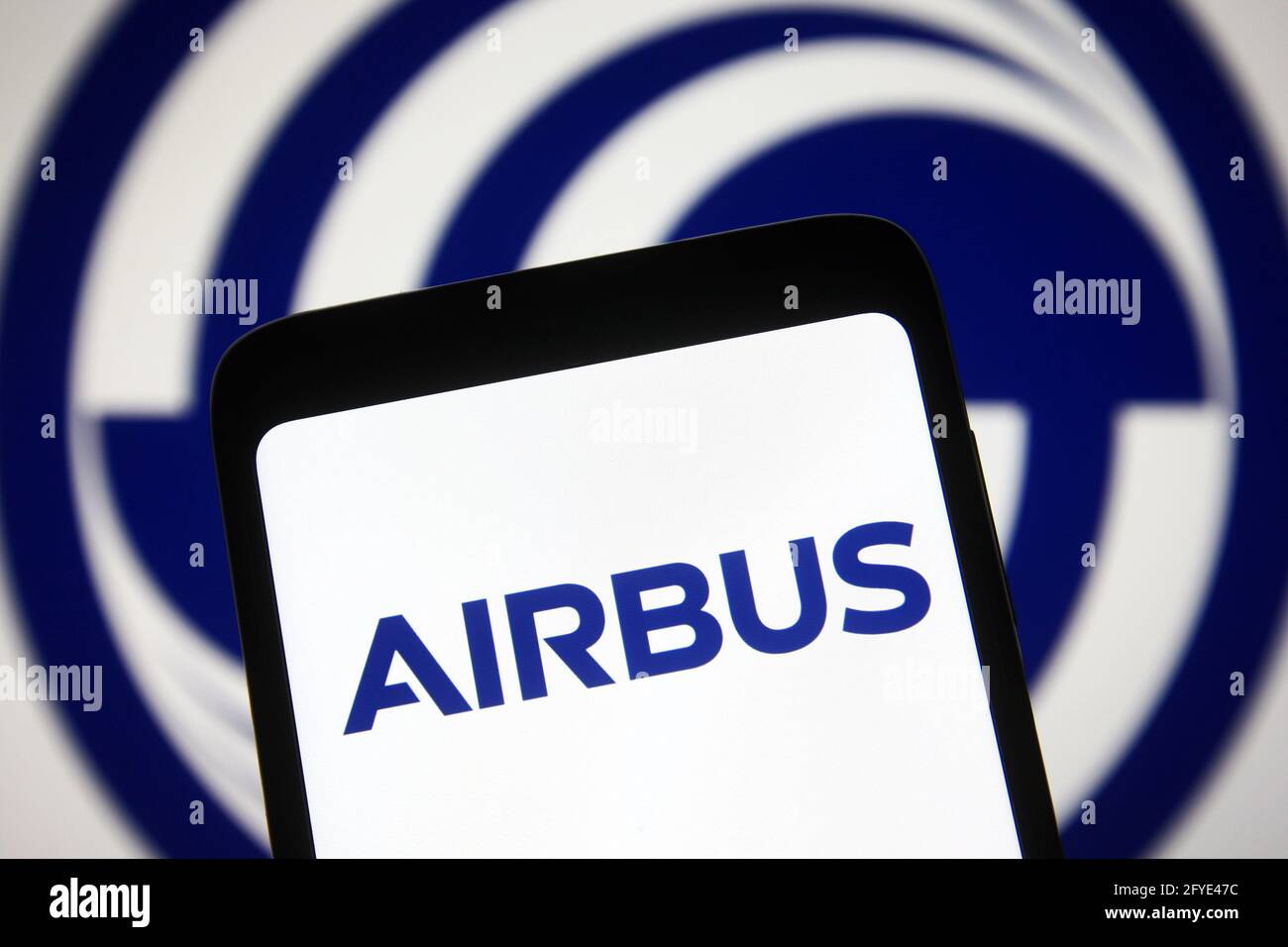 In this photo illustration, the Airbus logo seen on a smartphone and a ...