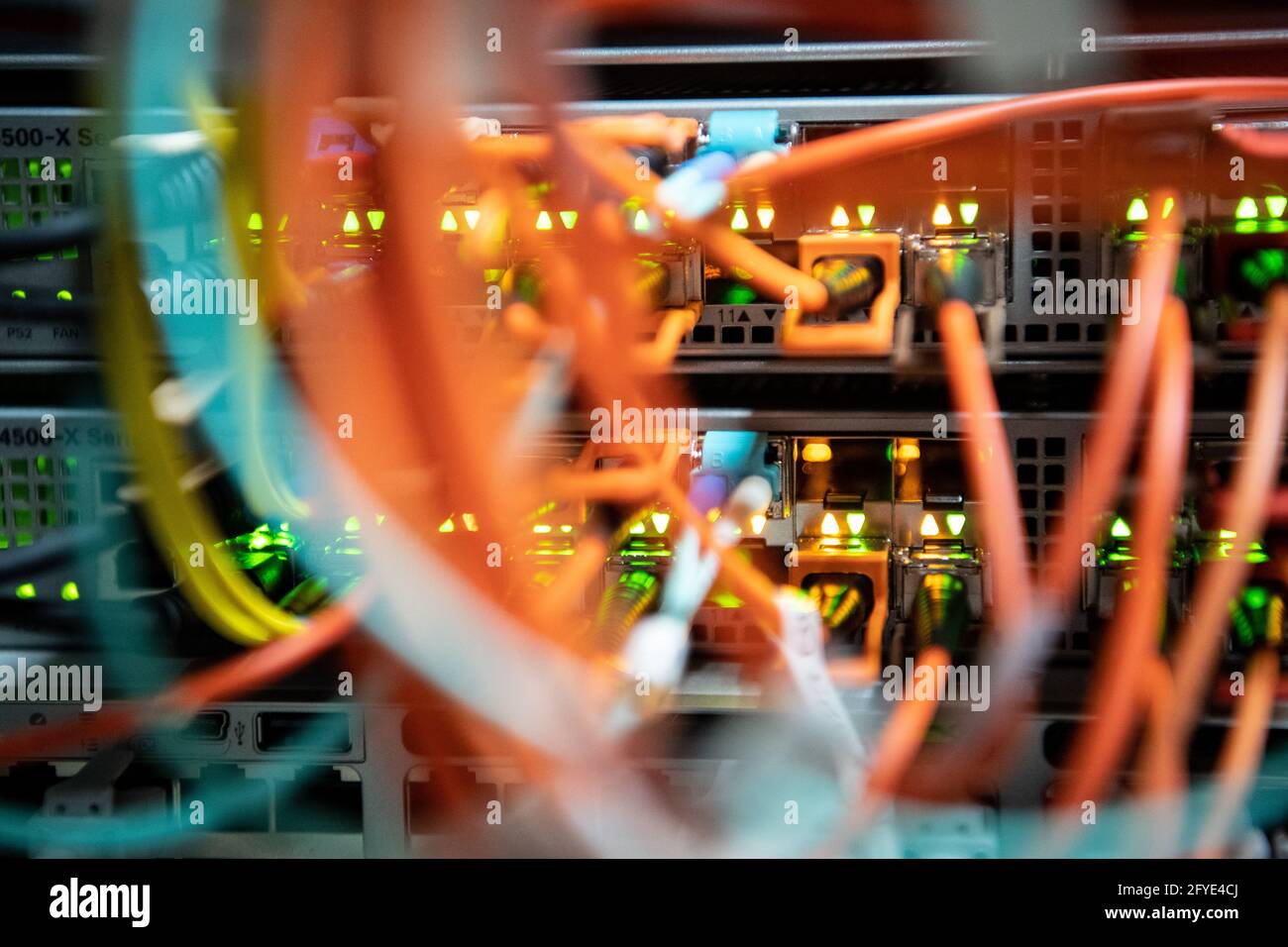 Munich, Germany. 18th May, 2021. Fiber optic cables are plugged into a ...