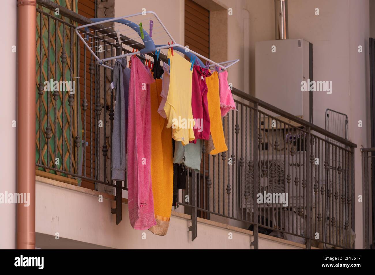 Clothesline on the balcony in Italy Stock Photo - Alamy