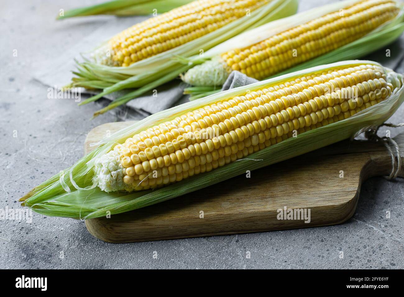 Fresh corn on cobs in a tissue bag. Zero waste concept. Close-up Stock ...