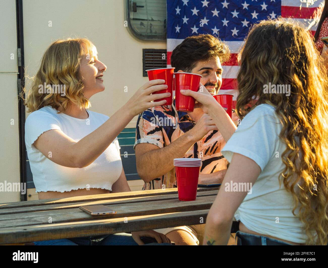 Group of young people clinking plastic red cups at a party Stock Photo ...