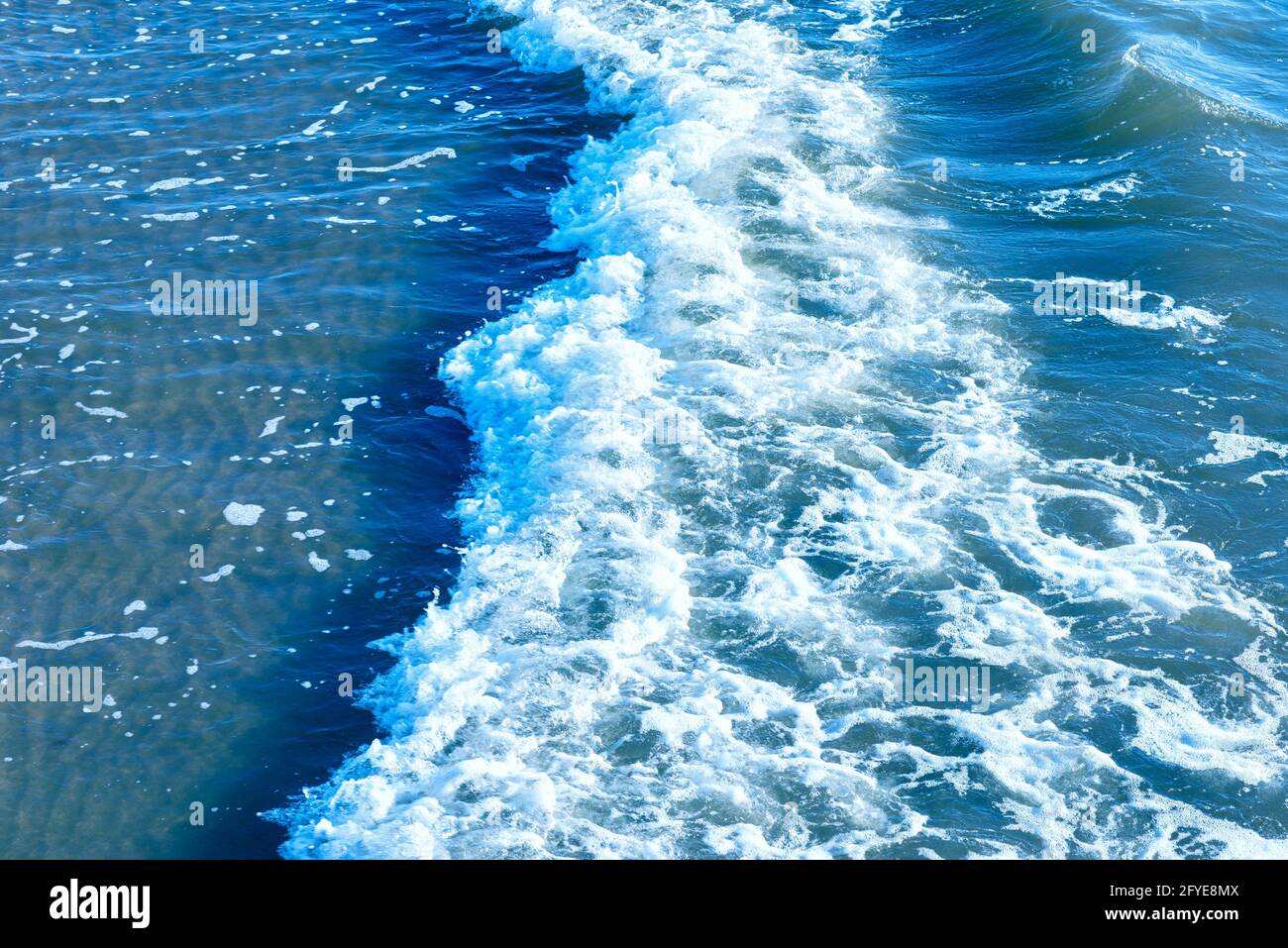 Areal shot of deep blue and rough sea with lot of sea spray.Blue ...