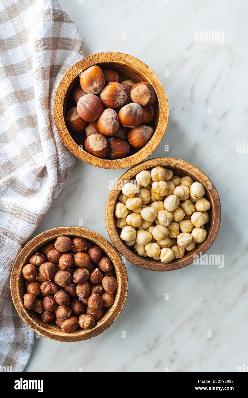 Peeled roasted hazelnut kernels in bowl. Top view Stock Photo - Alamy