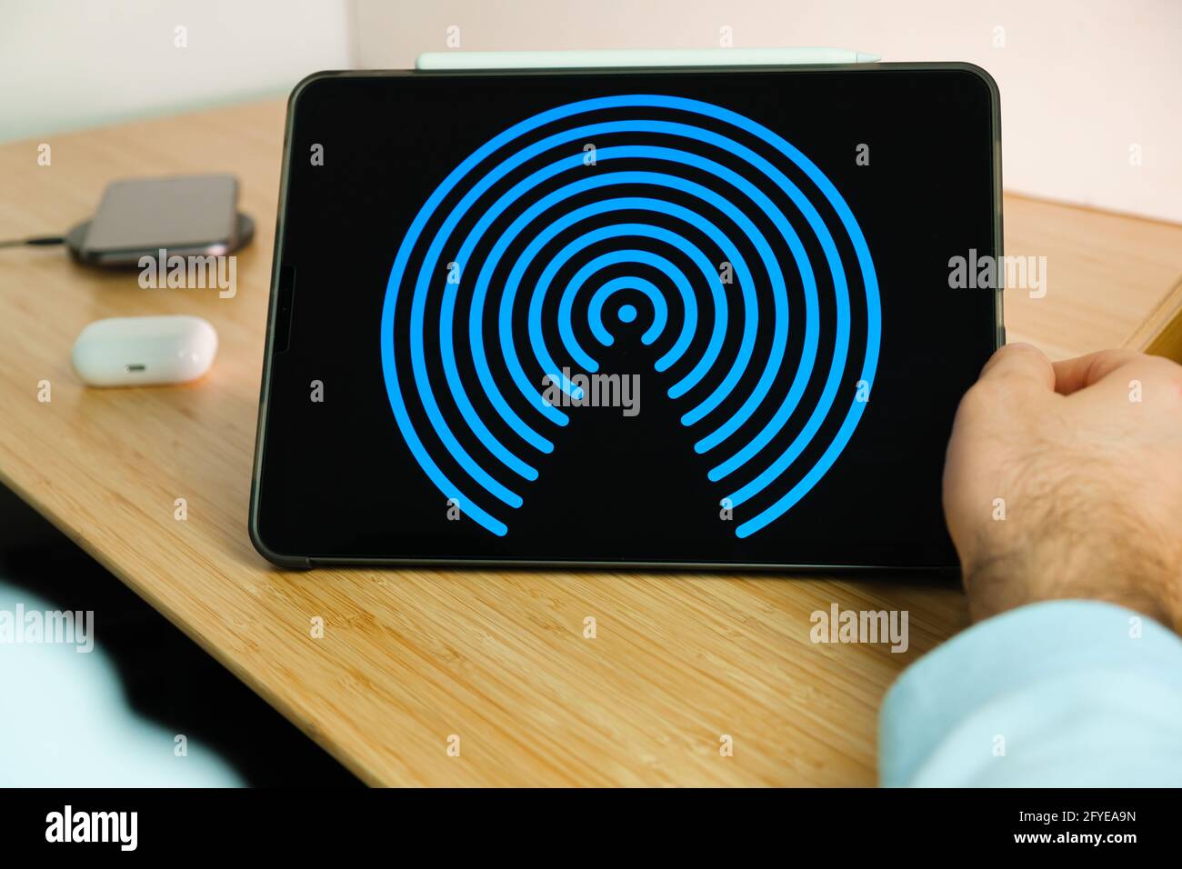 Apple Air Drop logo on the screen of iPad tablet. March 2021, San ...