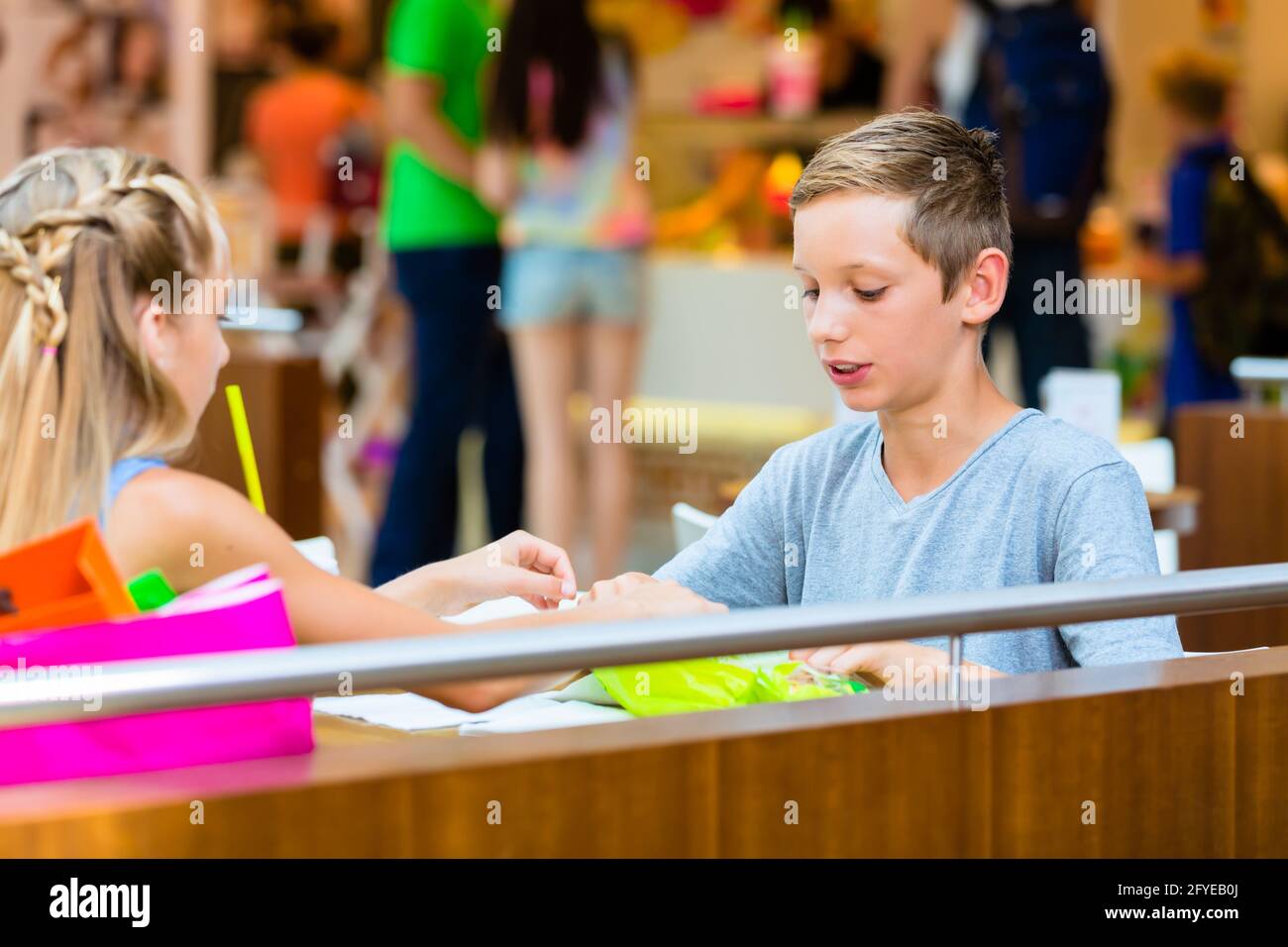 Happy children eating in cafe at shopping mall Stock Photo - Alamy