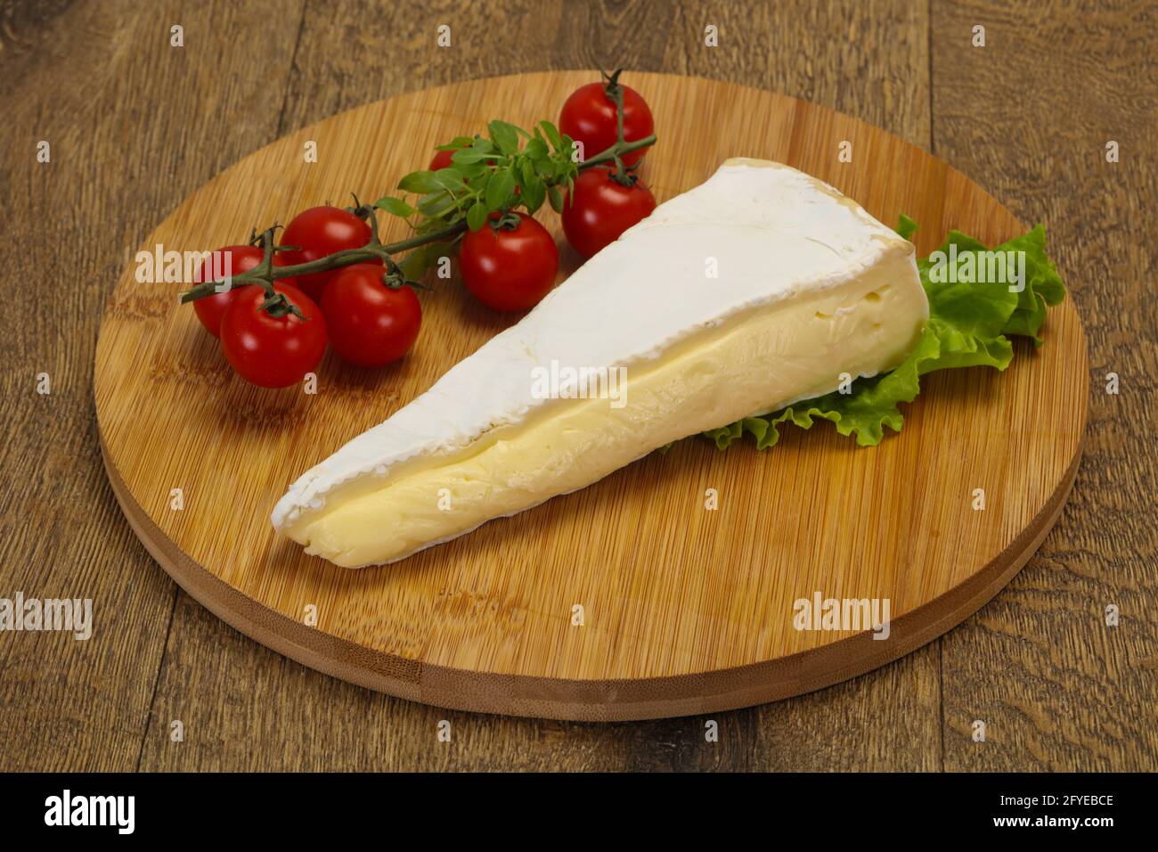 Brie cheese triangle served salad leaves Stock Photo - Alamy