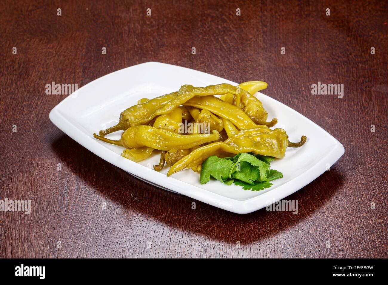 Pickled yellow pepper snack in the bowl Stock Photo - Alamy