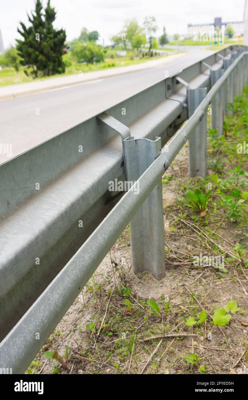 Street barrier next to a road Stock Photo - Alamy