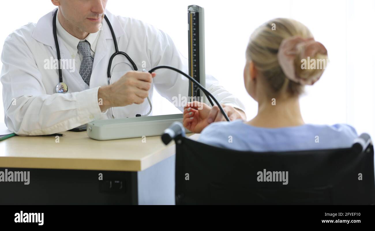 Doctor check up woman patient in clinic Stock Photo - Alamy