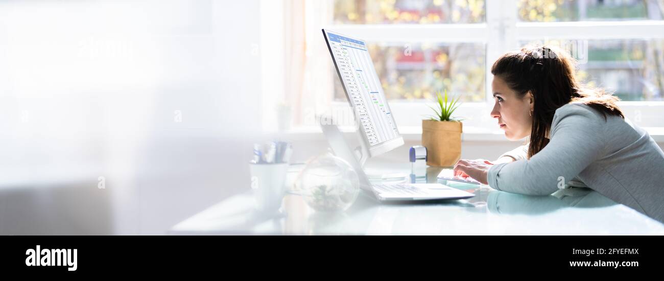Bad Posture Sitting In Office Chair At Computer Desk Stock Photo - Alamy