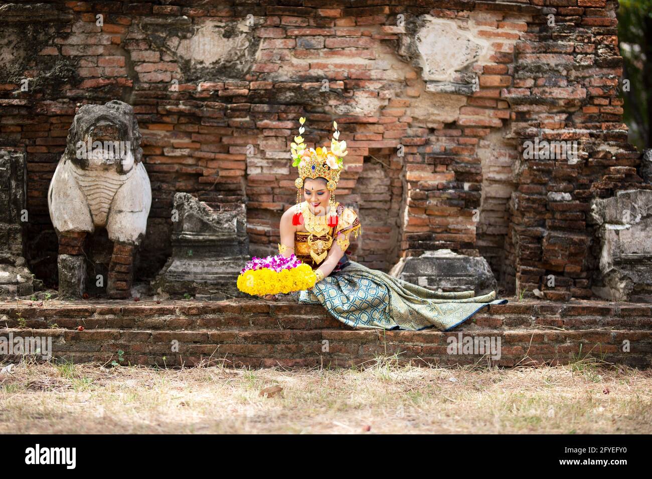 Asian travel background. Beautiful Balinese dancer woman in traditional ...