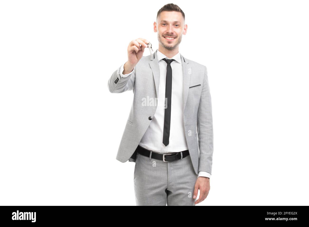 Horizontal medium portrait of handsome young adult Caucasian realtor ...