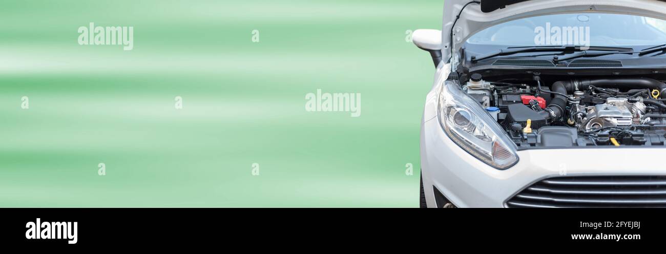 Front of new white car with open motor hood on blurred background Stock ...