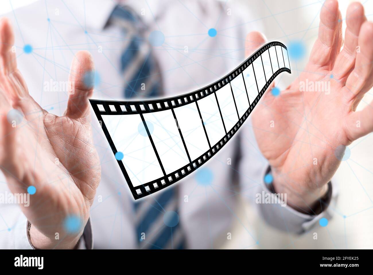 Movies, video and cinema concept between hands of a man in background ...