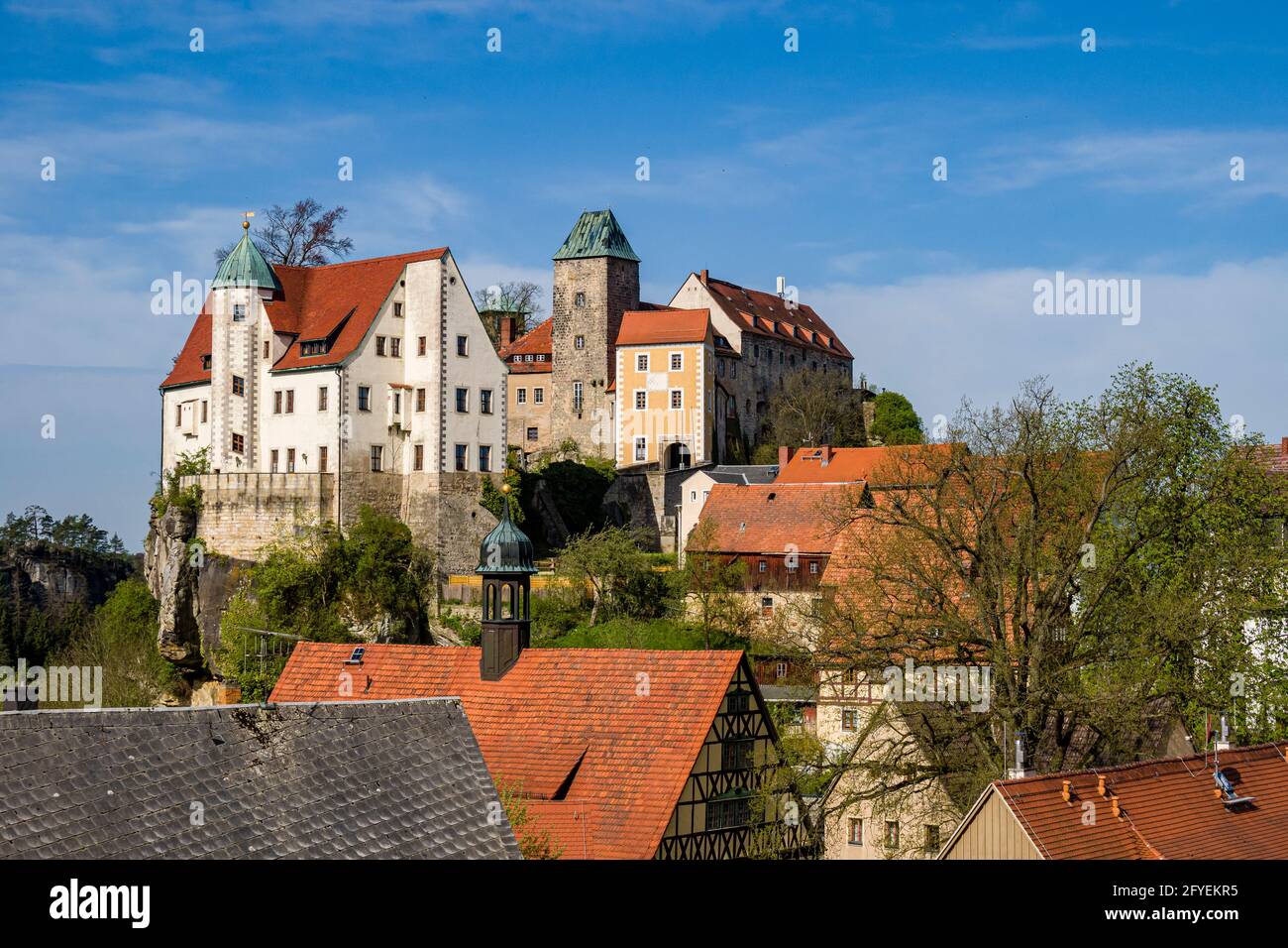 Hohnstein Castle, throning over the roofs of the small town Stock Photo ...