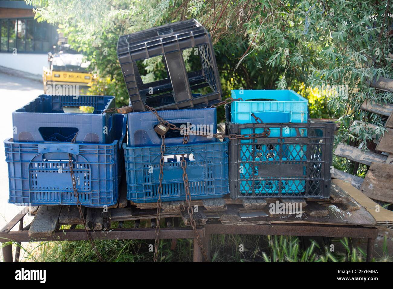 The gathered market stalls and plastic boxes of the street market set ...