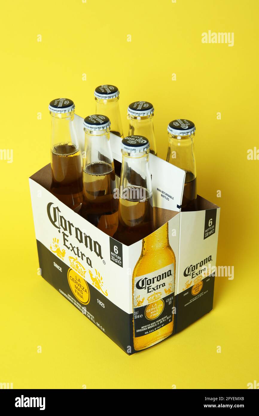 Carton box with Corona Extra on yellow background Stock Photo - Alamy