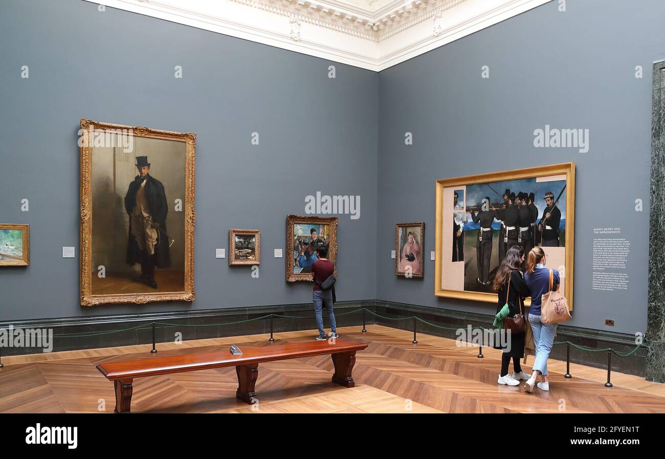 Visitors studying French Impressionist paintings in the National ...