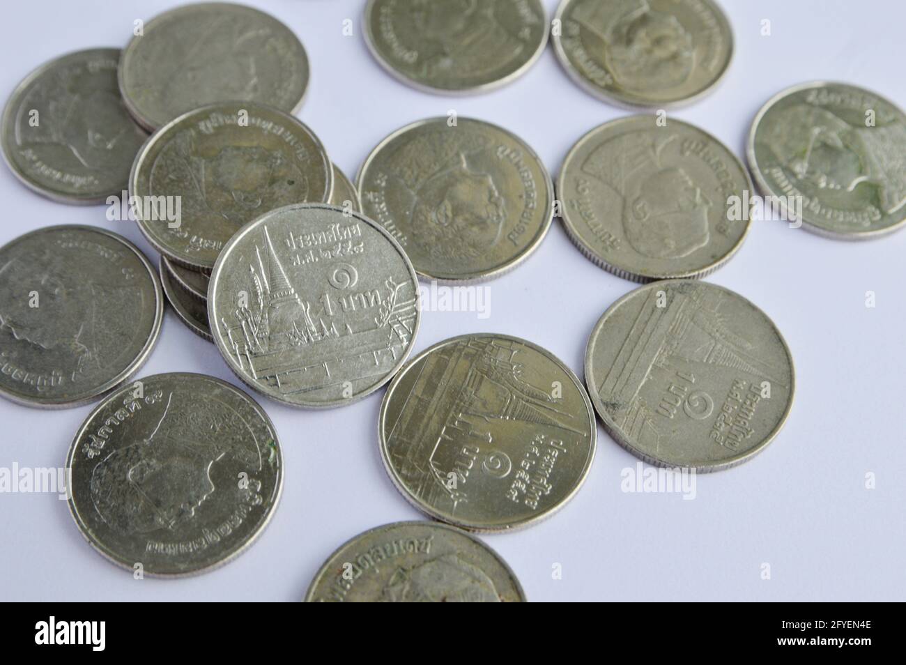 Multiple Thai Baht spread on white background Stock Photo - Alamy
