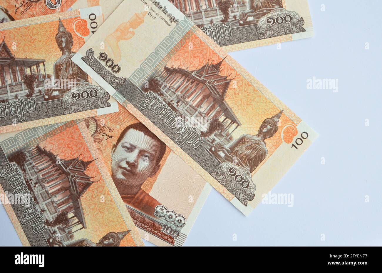 Cambodian Currency 100 riel spread out in white background Stock Photo ...