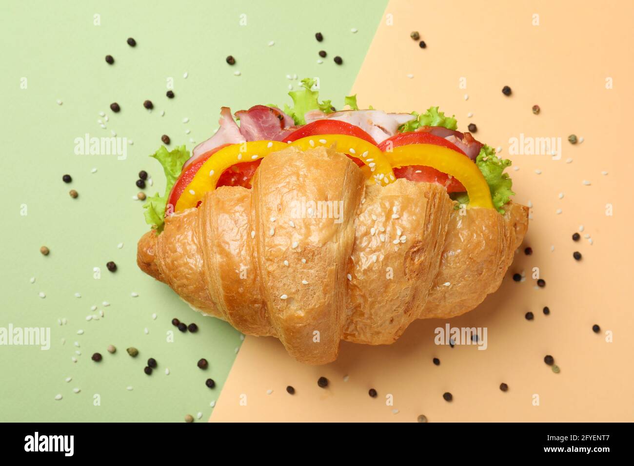 Tasty croissant sandwich on two tone background Stock Photo - Alamy