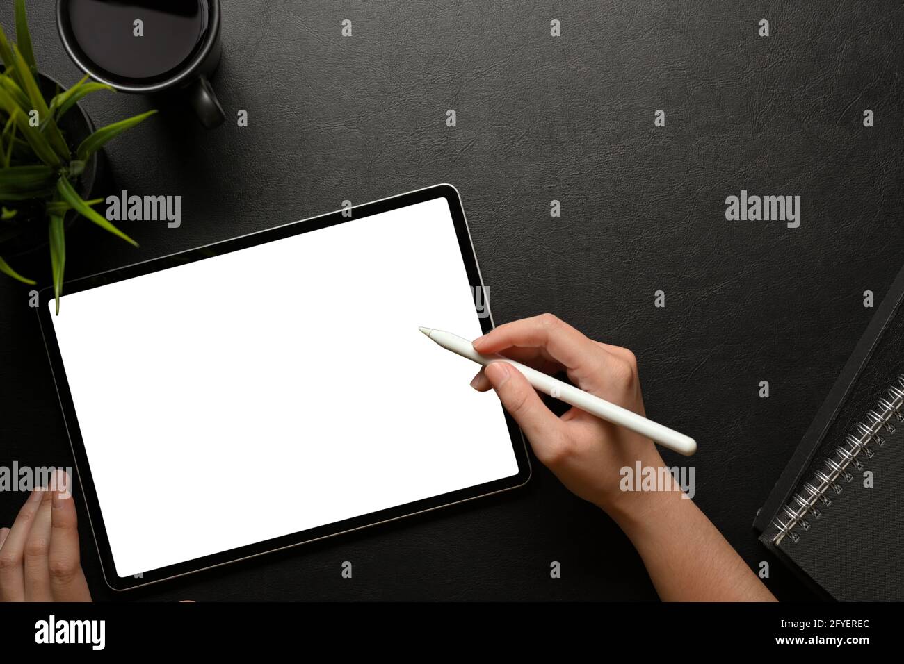 Top view of female hand using digital tablet include clipping path ...