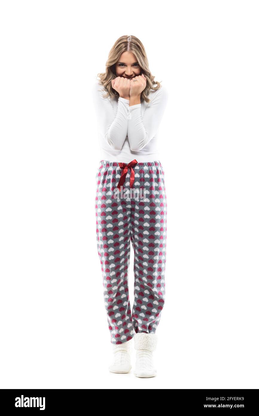 Impatient excited young hyped woman waiting in pajamas biting nails in ...