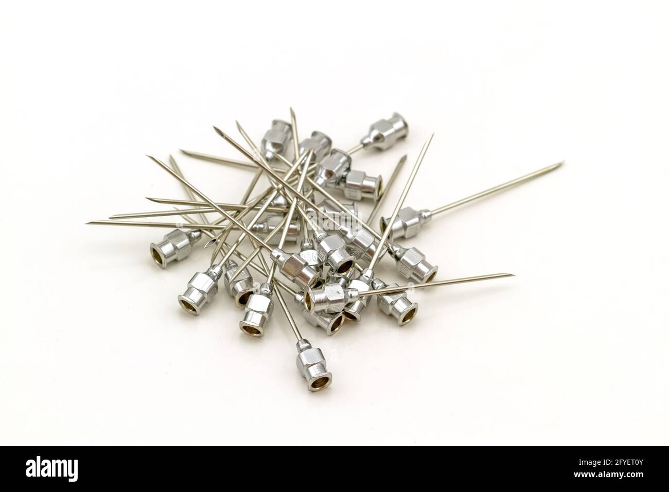 Stack of reuse iron needle No.18 G for drug needle on white background ...