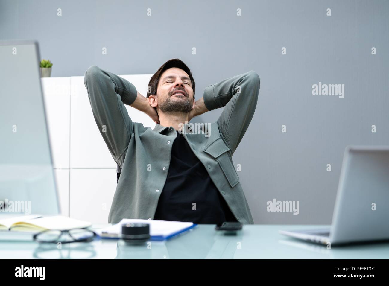 Business man relaxing desk boss hi-res stock photography and images - Alamy