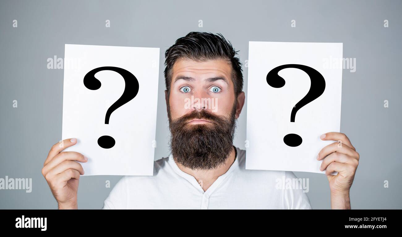 Man with question mark. Paper notes with question marks. Beard man ... Man with question mark. Paper notes with question marks. Beard man ...