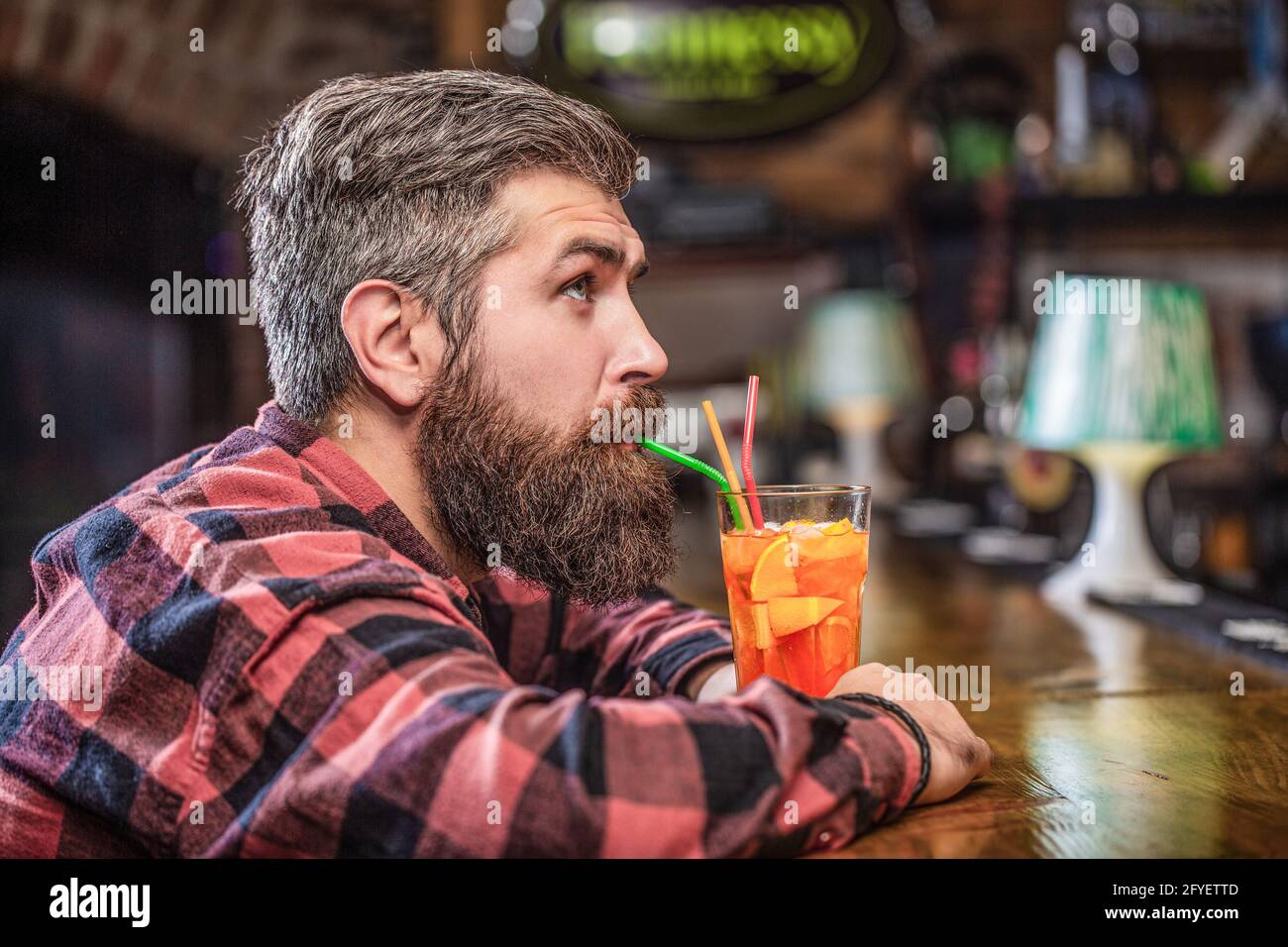 Tropical alcoholic fresh cocktail. Barman in pub or restaurant. Bearded ...