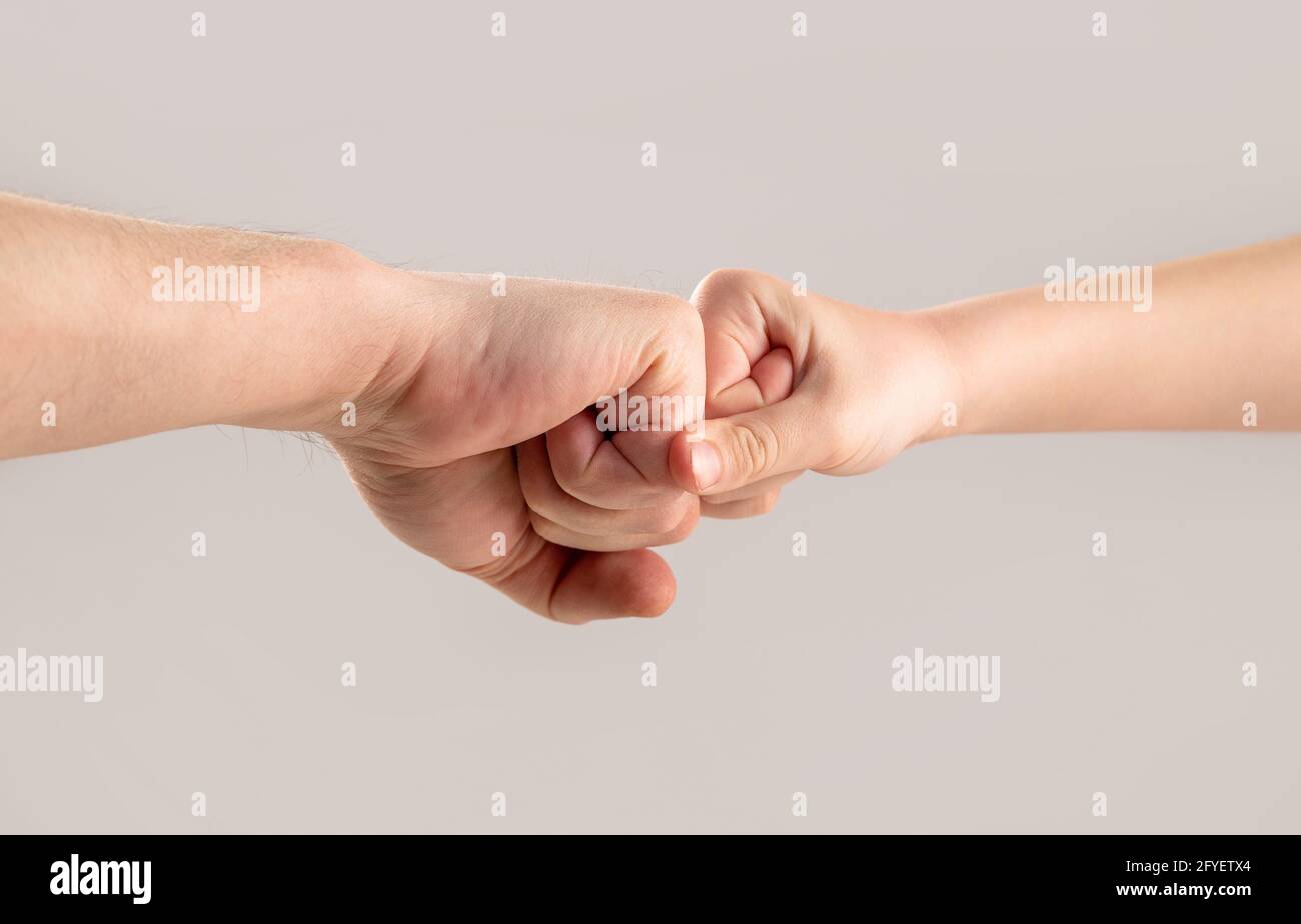 Two hands: man and child. Father and son touching fists. Old man and ...