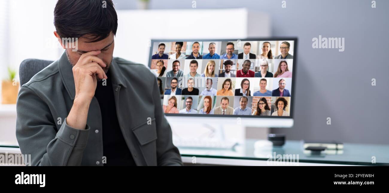 Bored Employee With Head Ache And Stress In Video Conference Call Stock ...