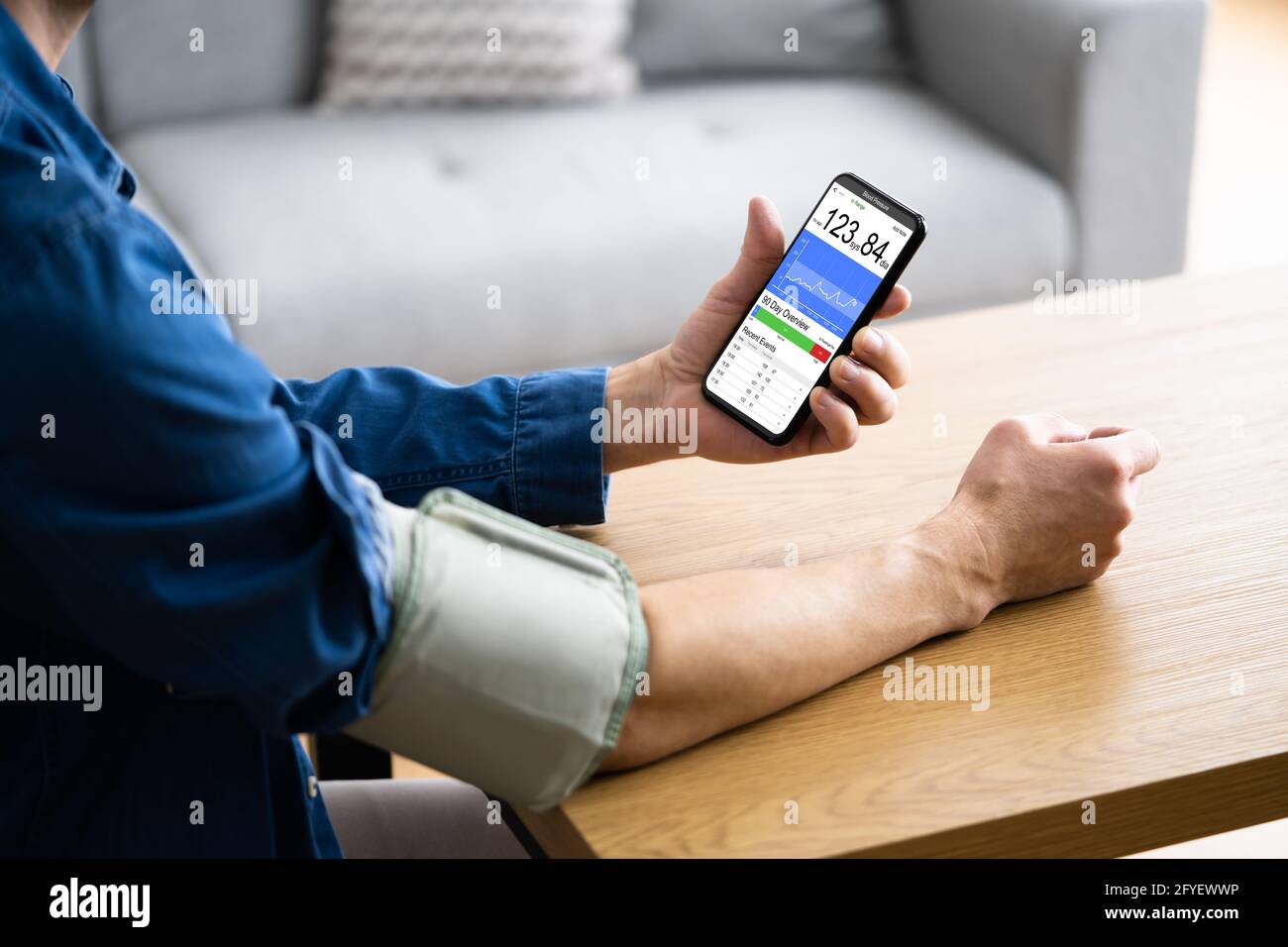 Blood Pressure Check Using Smart Monitor. African Patient Man Stock ...