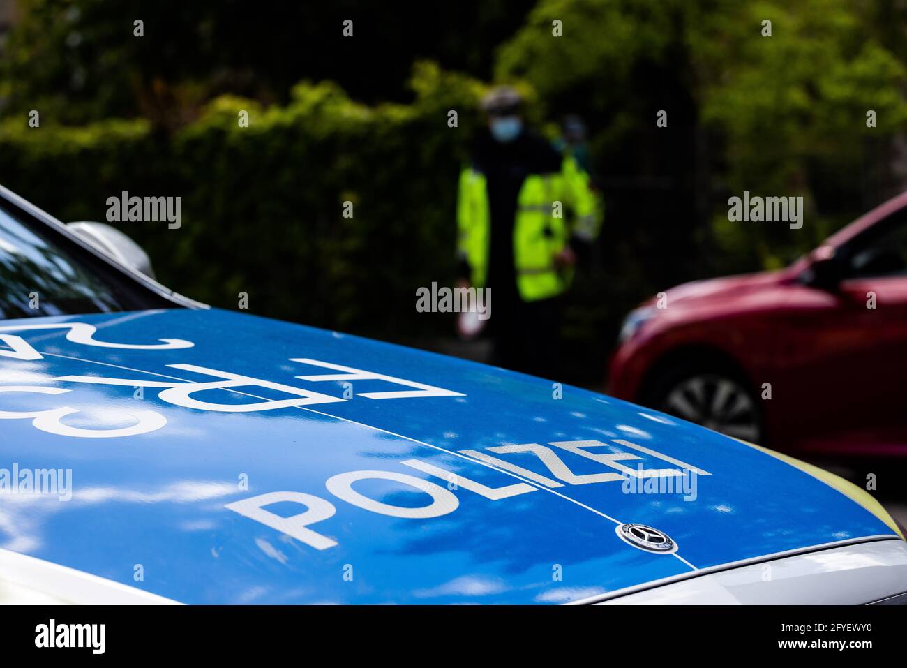 Freiburg, Germany. 05th May, 2021. A police officer wearing a mouth ...