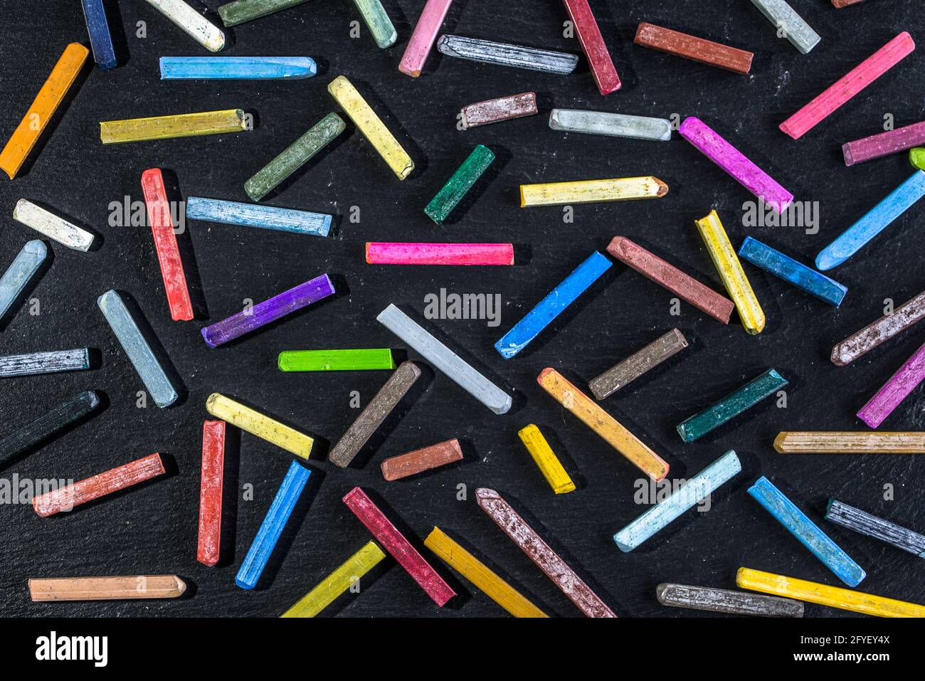 Colorful wallpaper with chalks, pattern on black background of ...